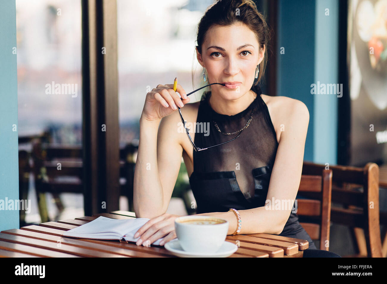 Attractive girl with a notepad Stock Photo - Alamy