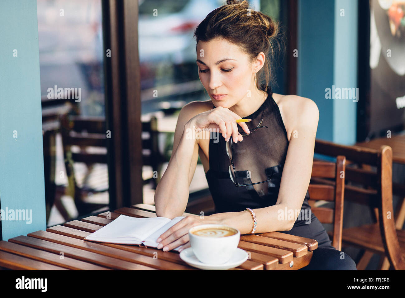 Attractive girl with a notepad Stock Photo - Alamy
