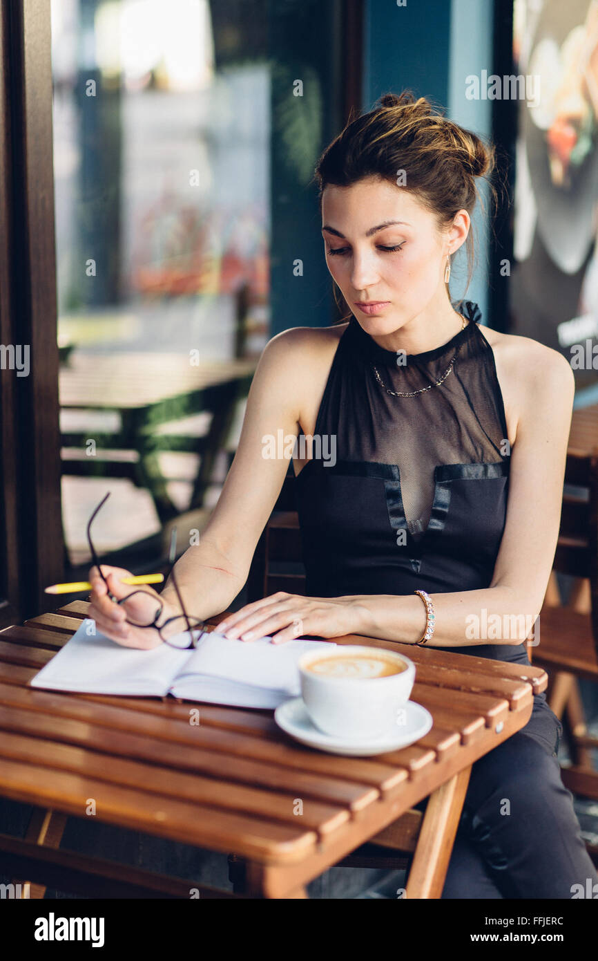 Attractive girl with a notepad Stock Photo - Alamy