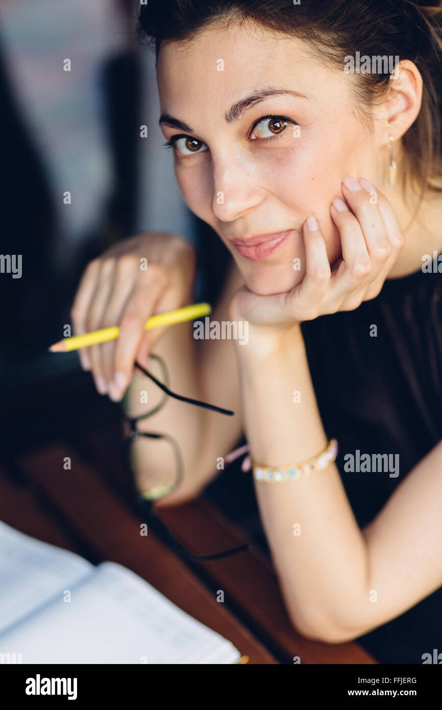 Attractive girl with a notepad Stock Photo - Alamy