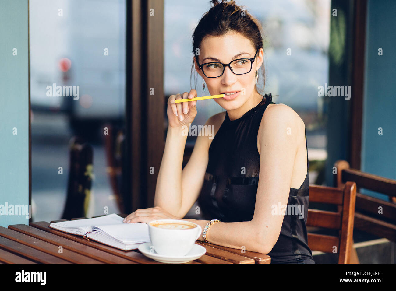Attractive girl with a notepad Stock Photo - Alamy