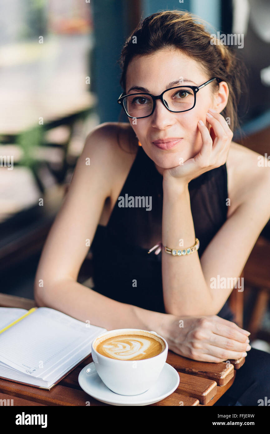 Attractive girl with a notepad Stock Photo - Alamy