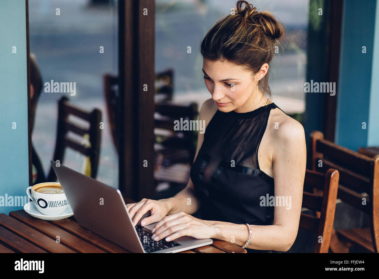 Attractive business woman working at his laptop Stock Photo - Alamy