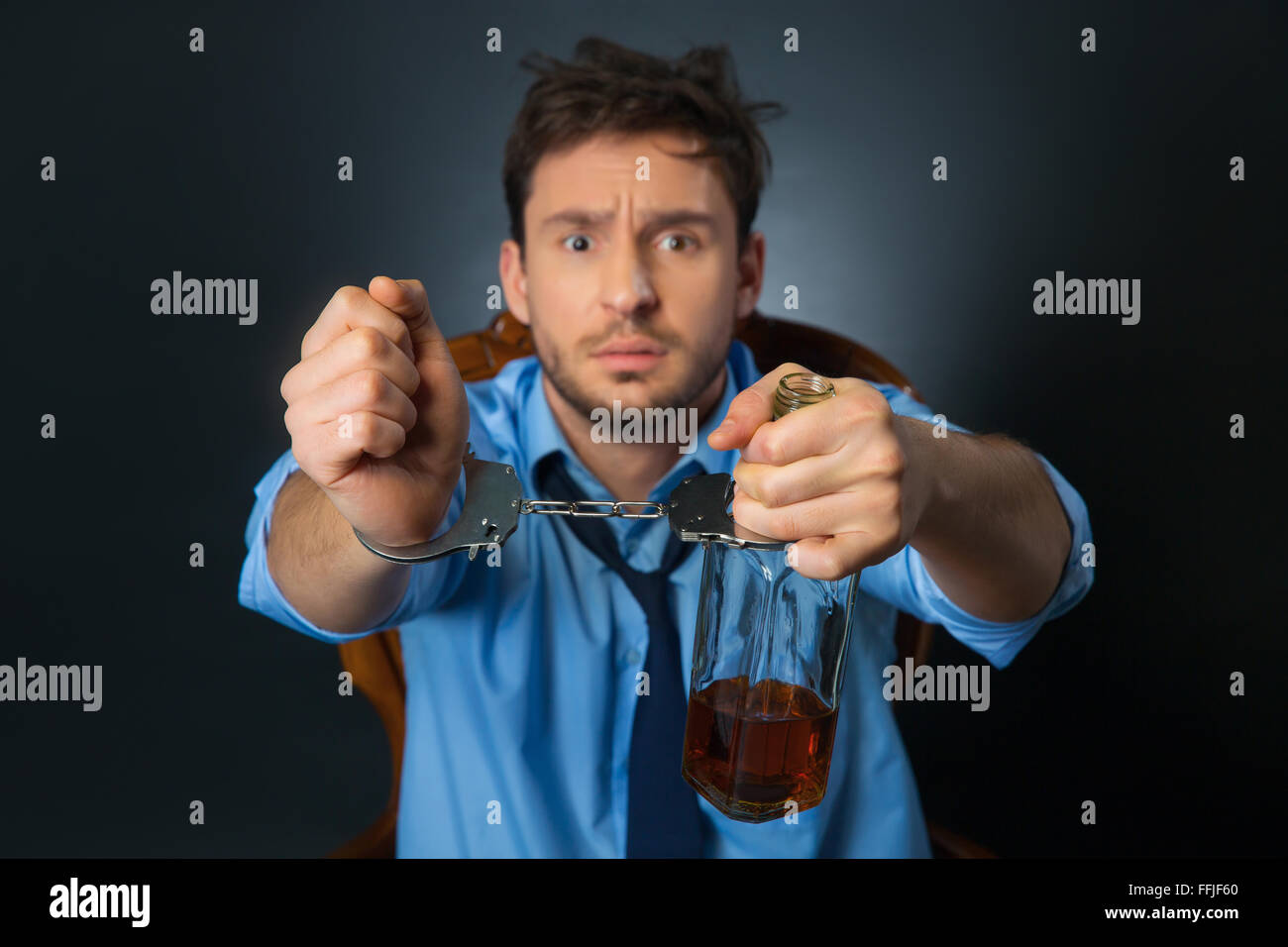 Drunk man drinking alcohol Stock Photo - Alamy