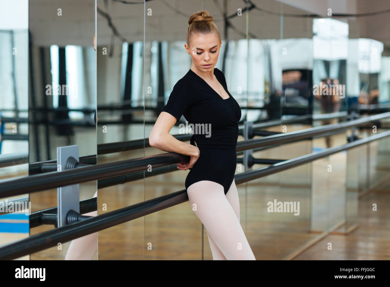 Attractive female dancer resting in ballet class Stock Photo - Alamy