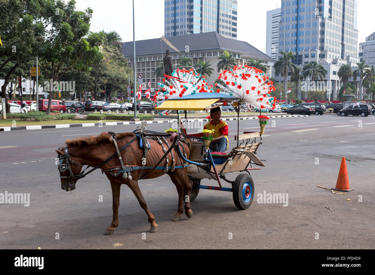 JAKARTA - August 10: Horse drawn carriage in the street of Jakarta ...