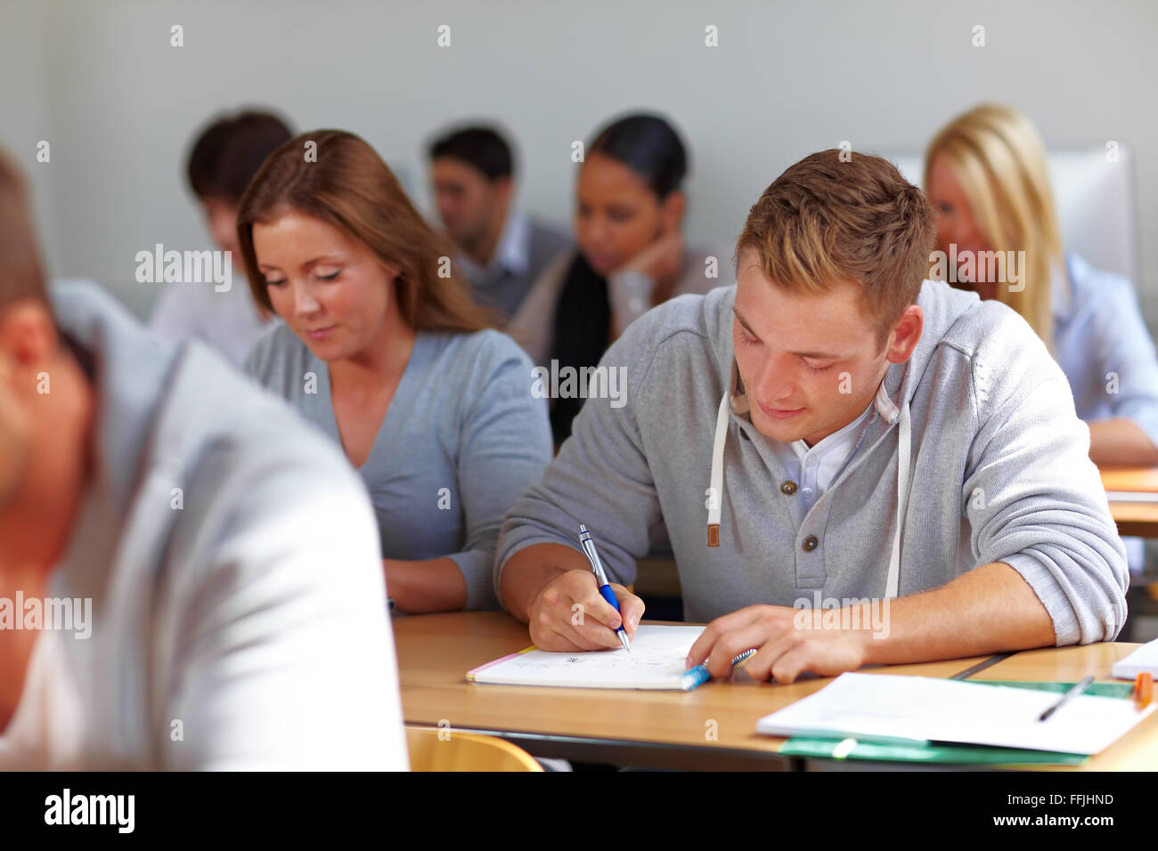 Many students learning in class at university Stock Photo - Alamy