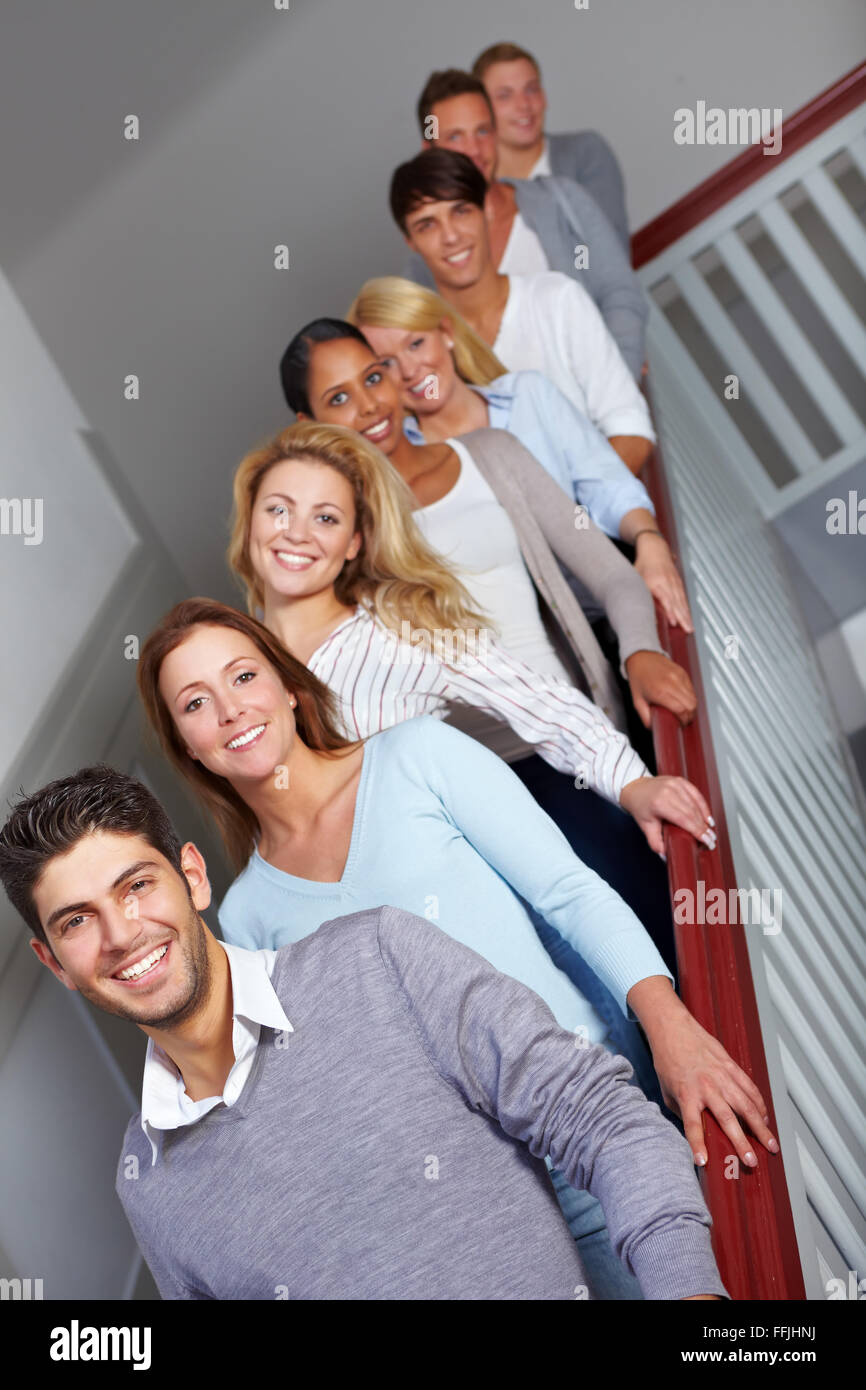 Young smiling students standing in waiting queue Stock Photo - Alamy