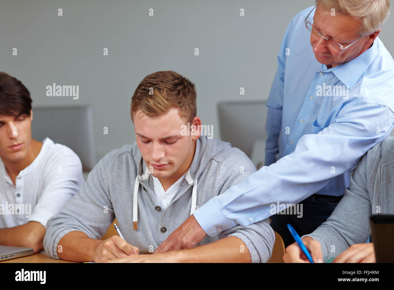 Teacher giving test class hi-res stock photography and images - Alamy