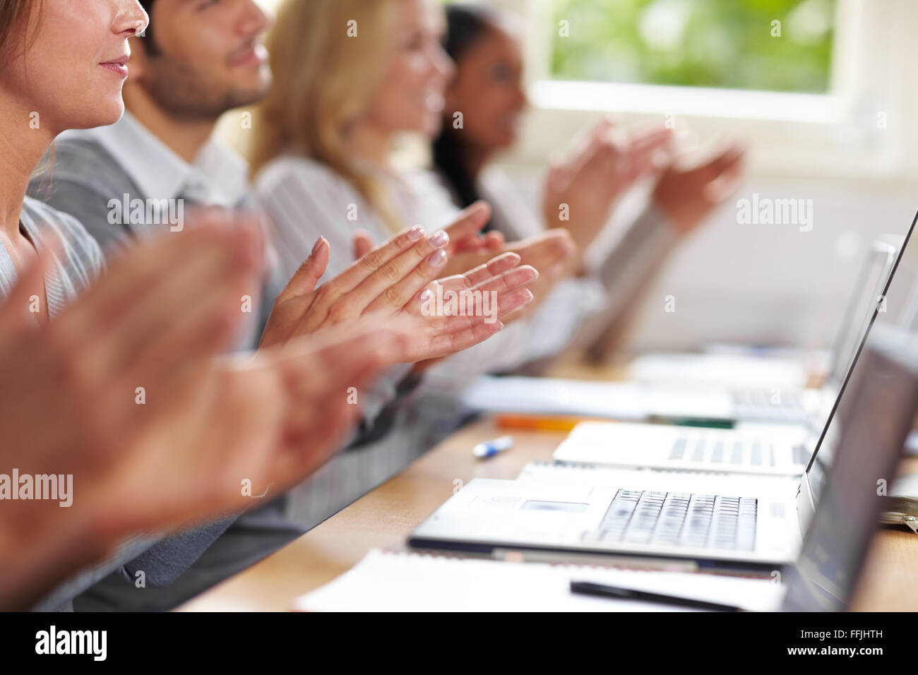 Students clapping hands for applause after university lecture Stock ...