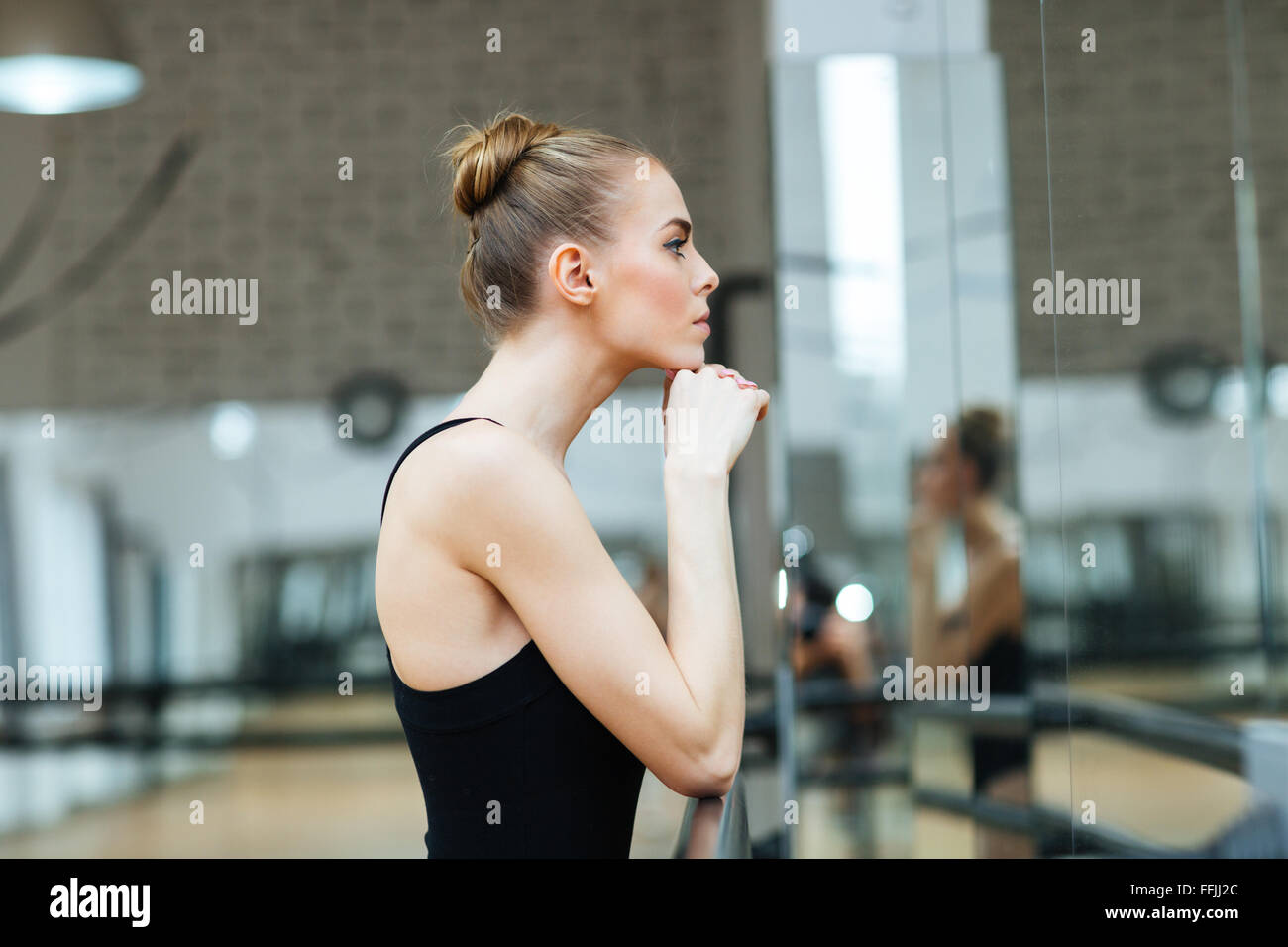 Ballerina resting in ballet class Stock Photo - Alamy