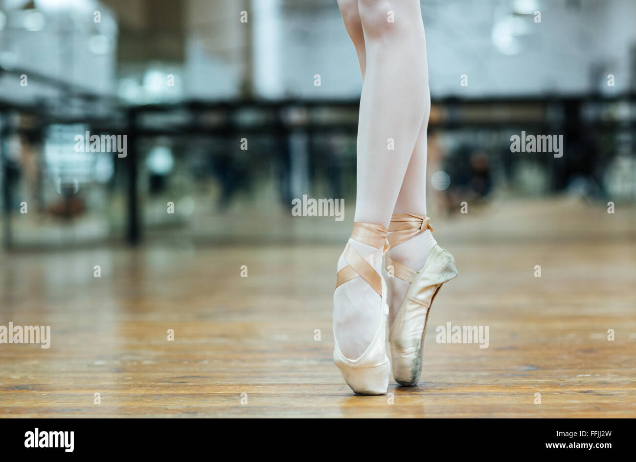 Cropped image of a female ballet dancer standing on toes Stock Photo ...