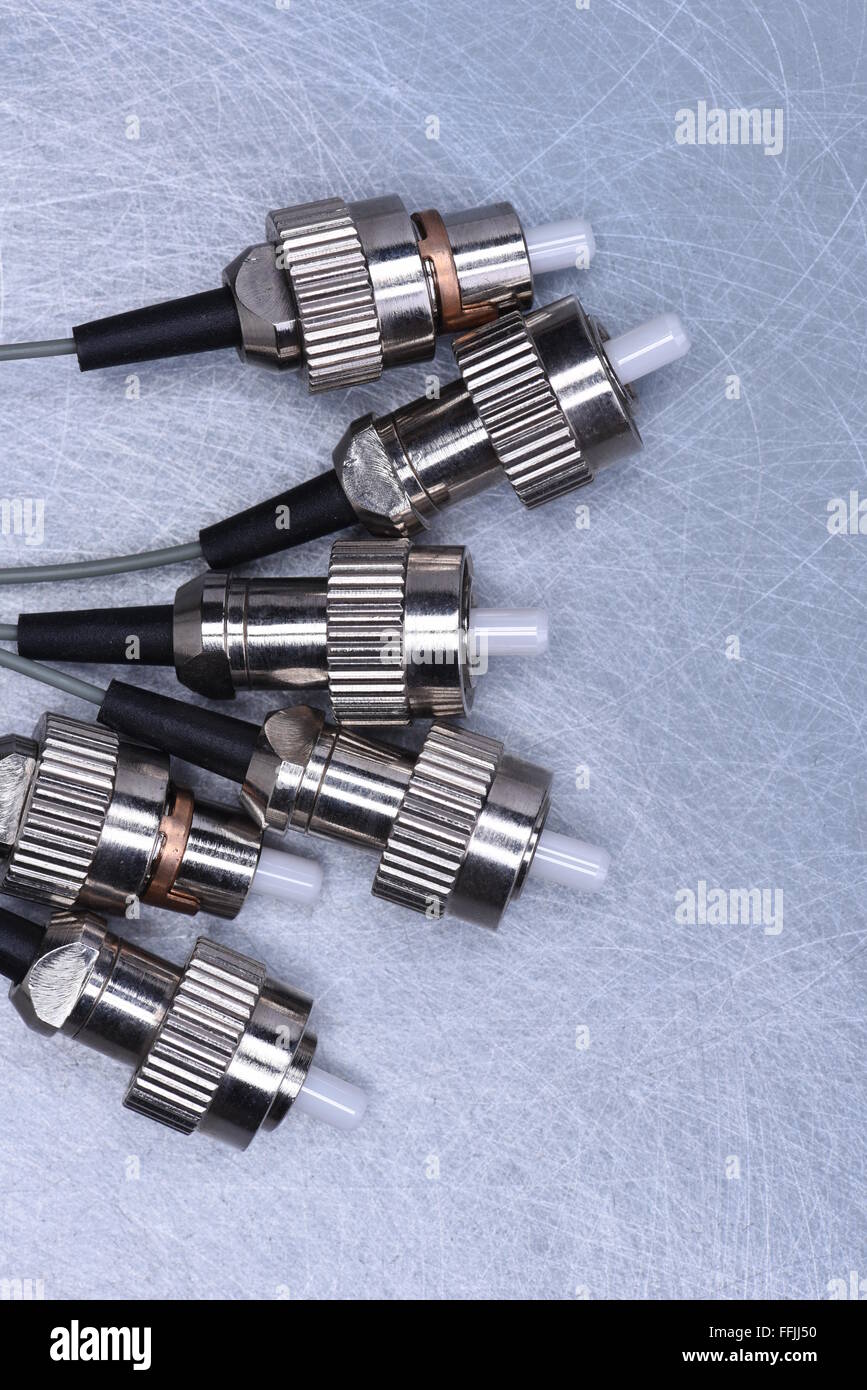 Fiber optic cable in telecommunication networks on metal background ...