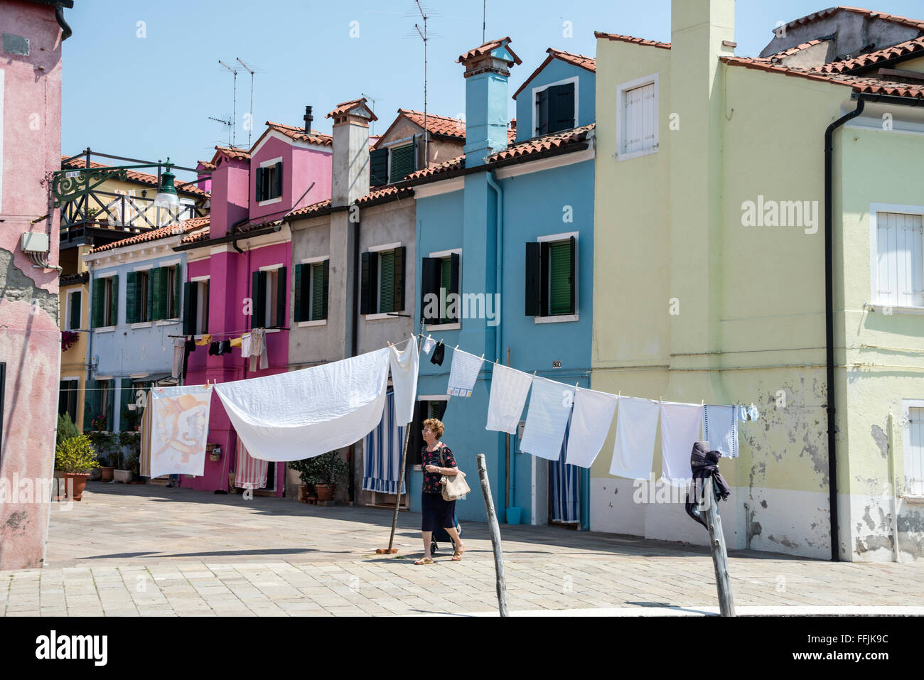 The small fishing village and tiny port of Burano, on an island in the ...