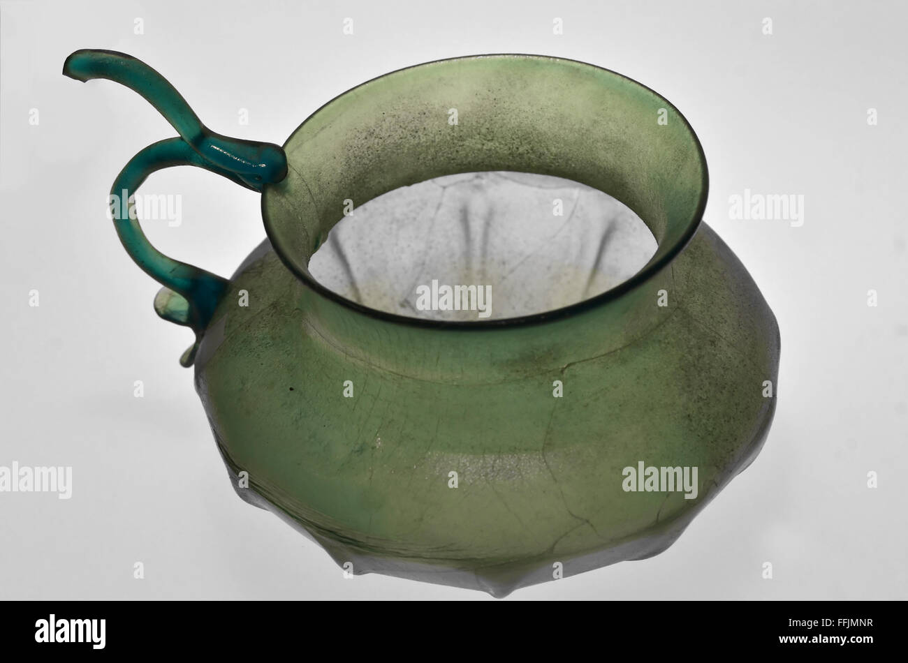 beautiful ancient roman green glass bowl with single ornate blue handle ...