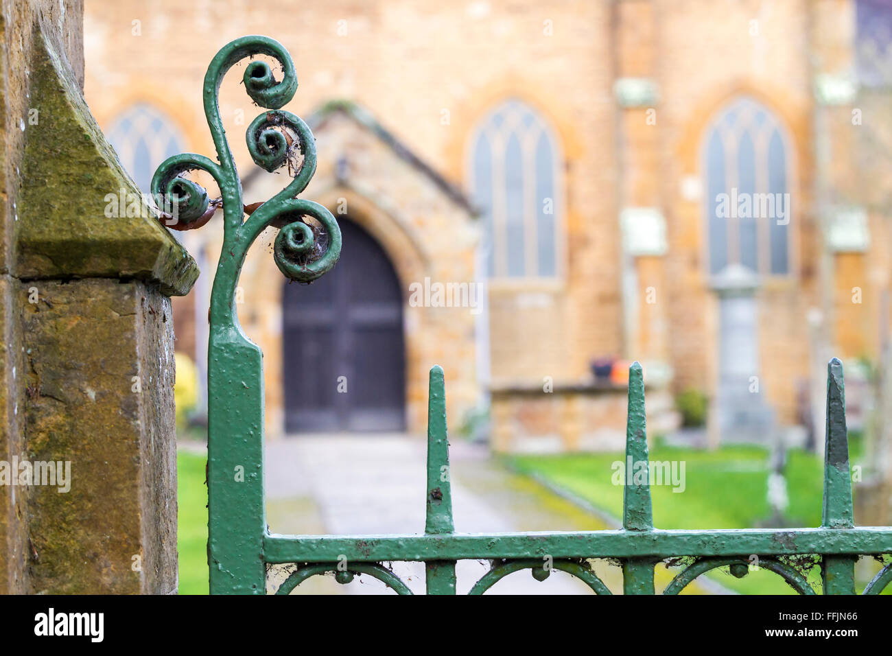 Wrought ironwork on railings around St Peter and Paul church Abington ...