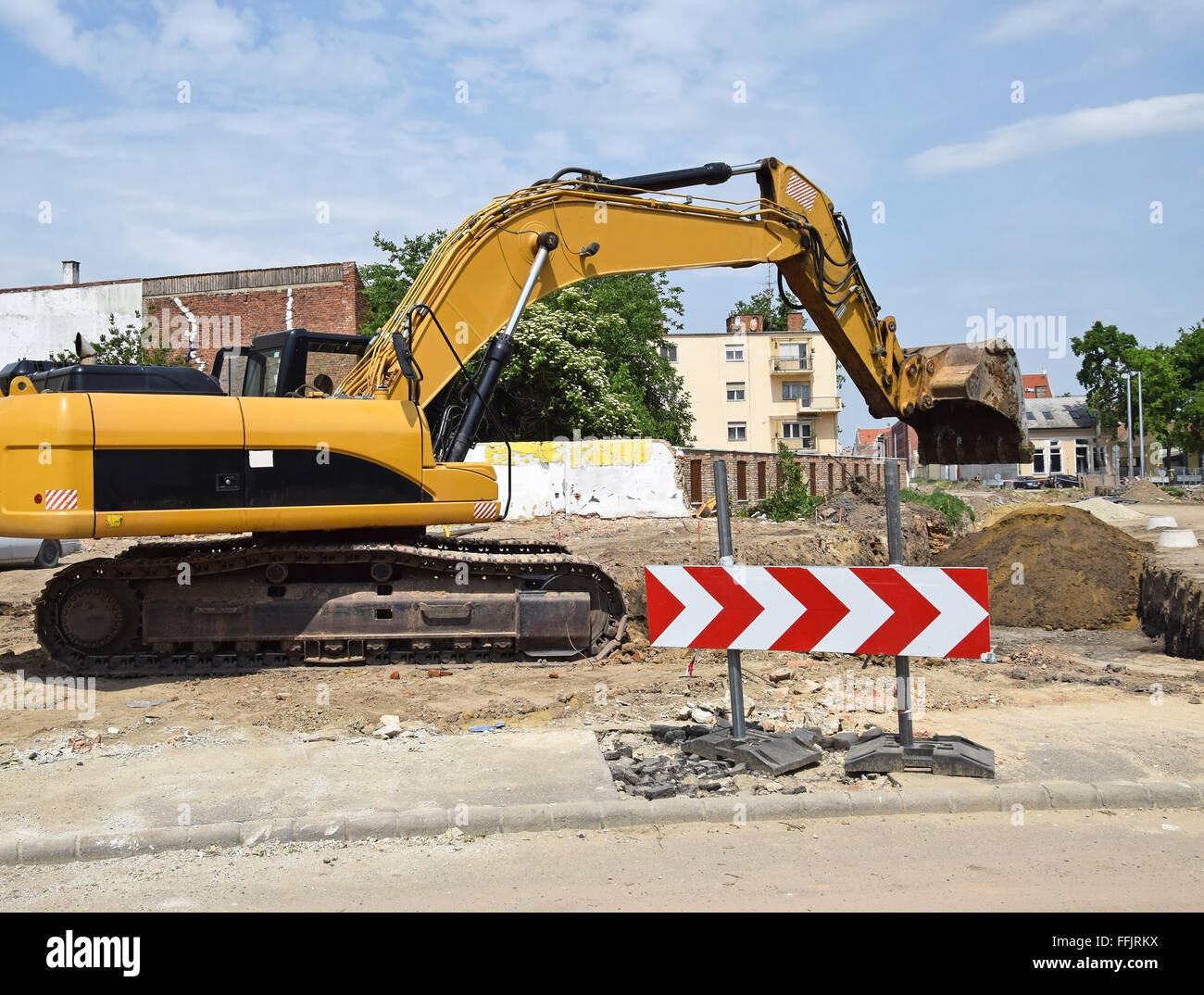 Excavator at the road construction Stock Photo - Alamy
