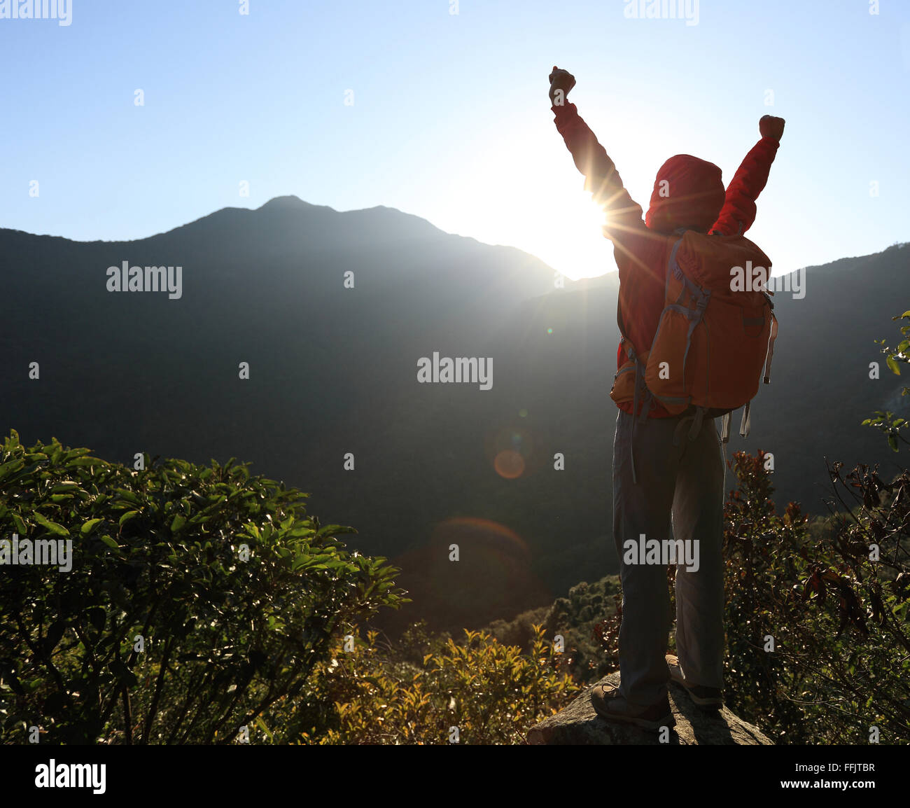 successful woman hiker open arms on sunrise mountain peak Stock Photo ...