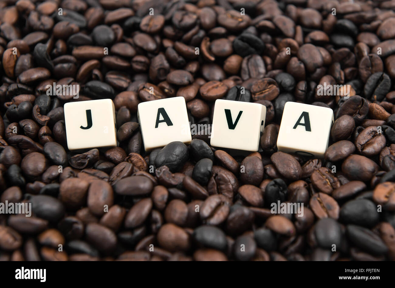 JAVA white cube text on coffee beans background Stock Photo - Alamy