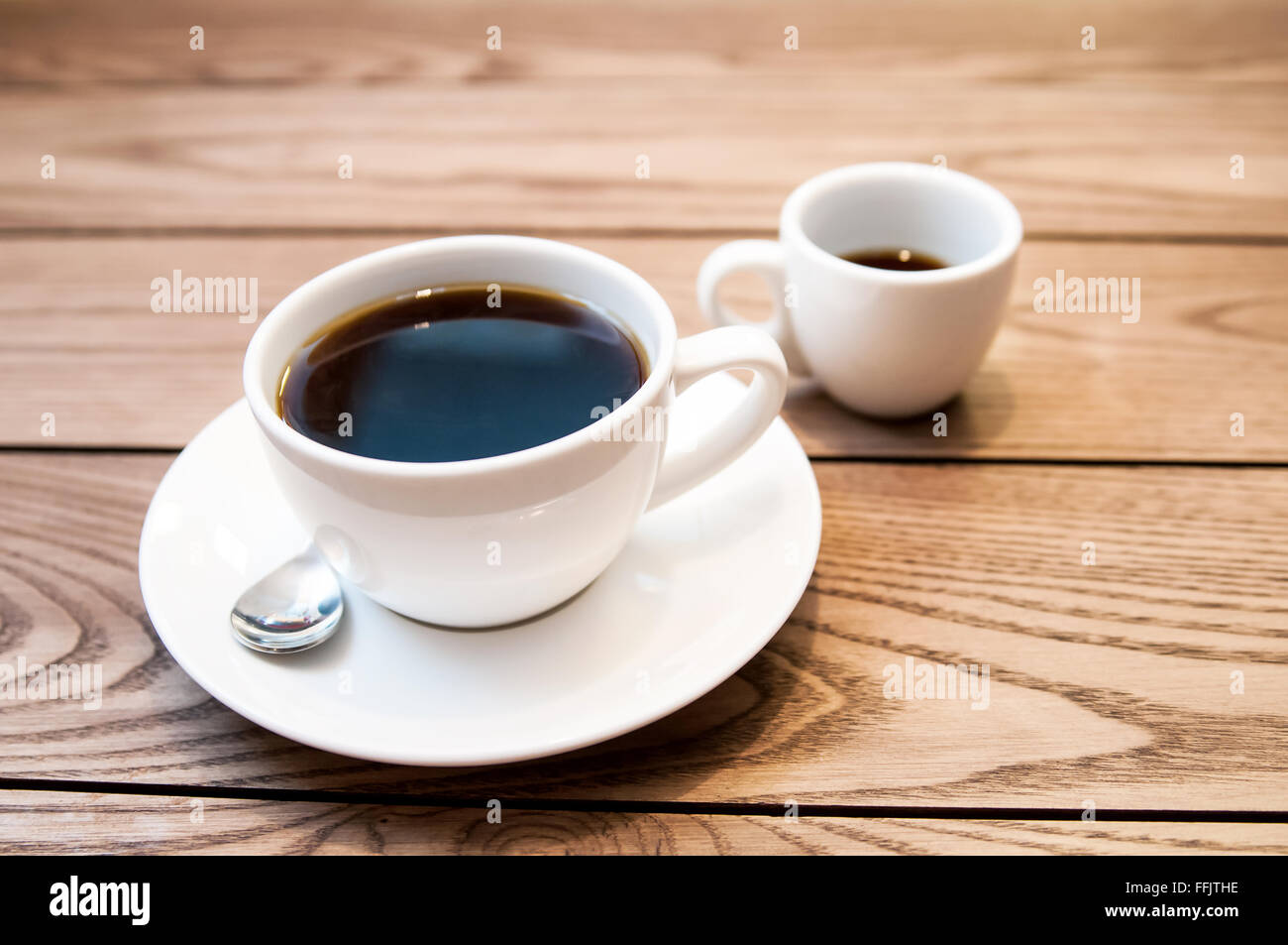 Americano on a wood table, espresso Stock Photo - Alamy