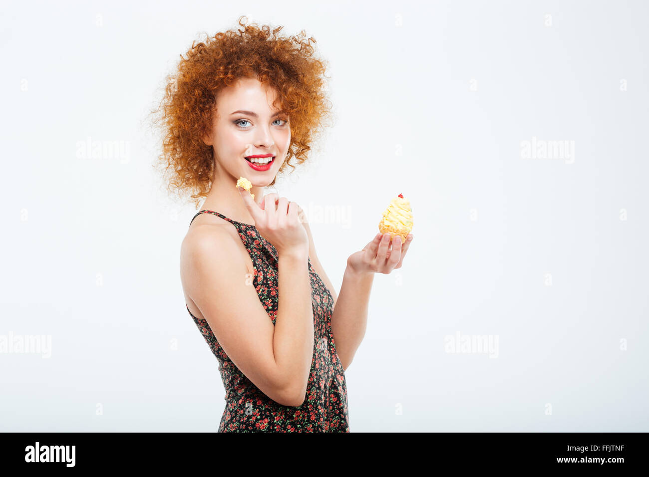 Happy redhead woman holding cake isolated on a white background Stock ...