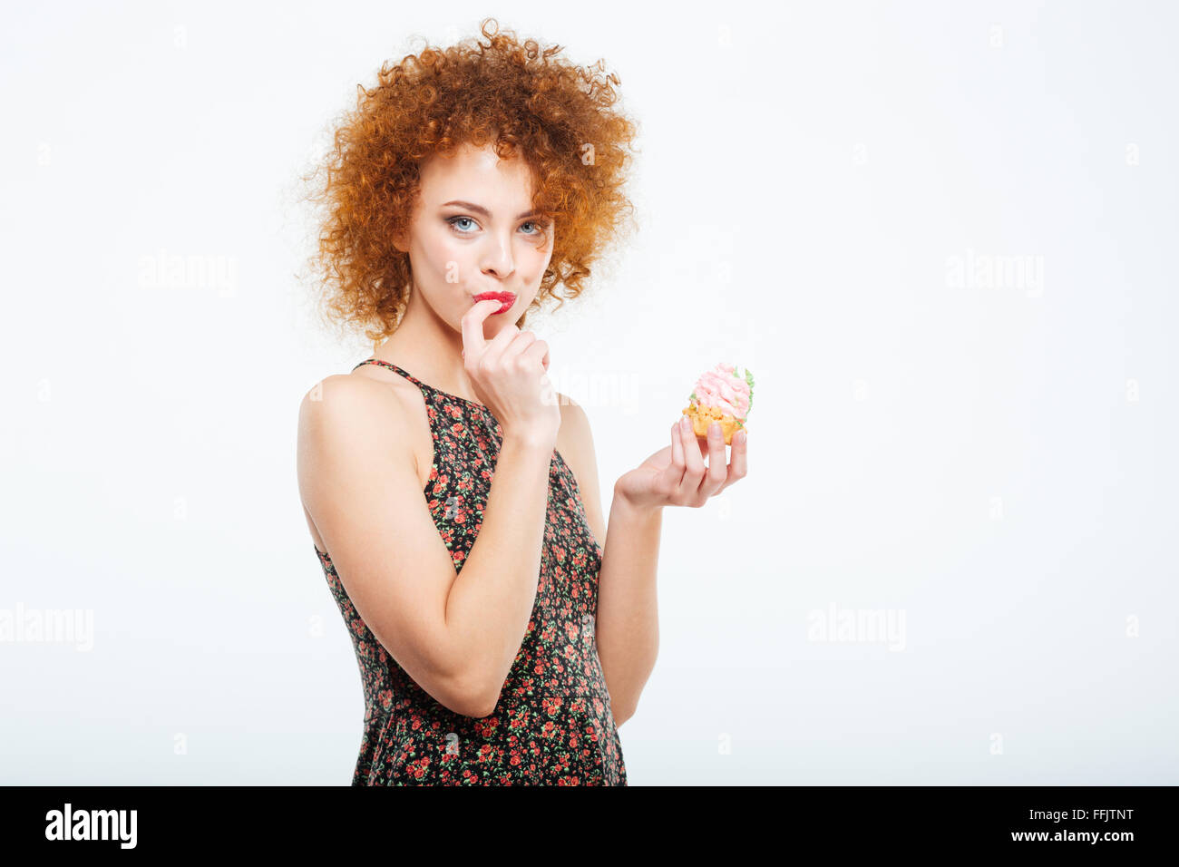 Beautiful Redhead Woman Eating Cake Isolated On A White Background