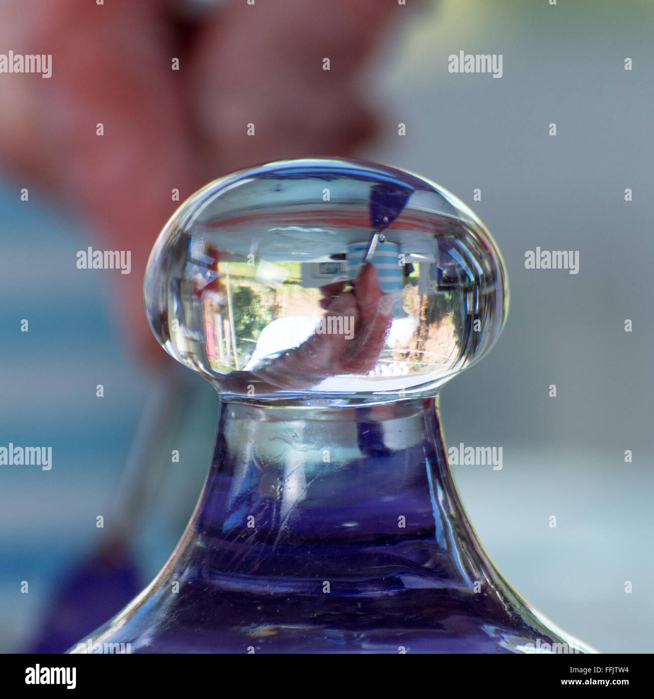 paint mixing seen through the lens of a glass mullers handle Stock ...