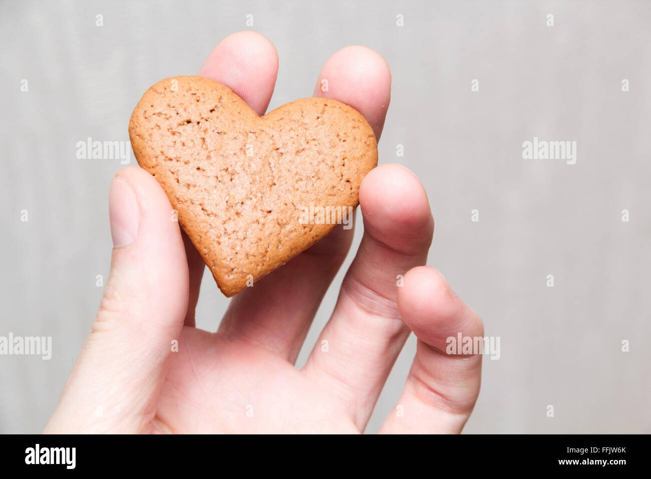 gingerbread in hand Stock Photo - Alamy