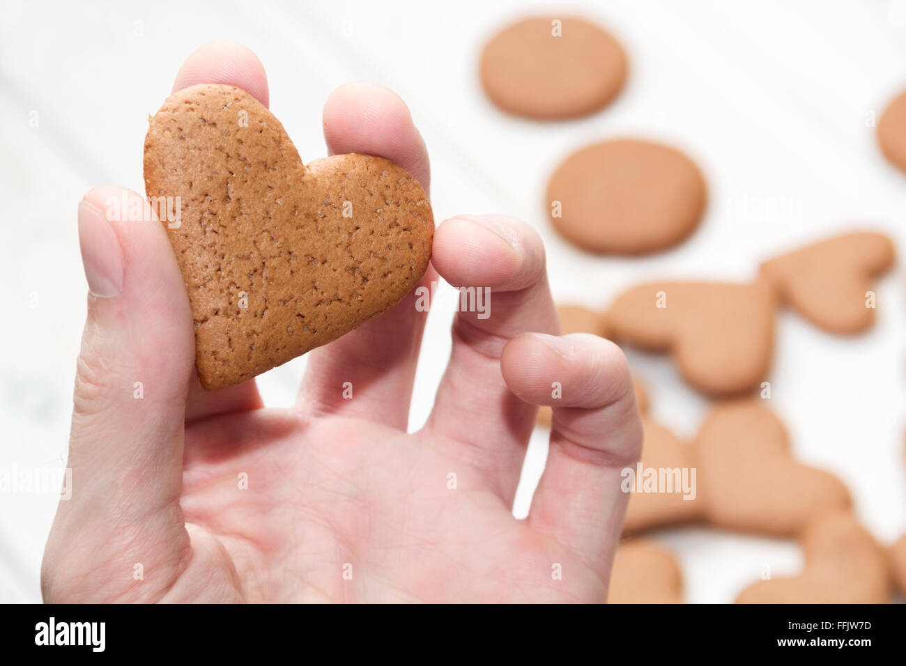 gingerbread in hand Stock Photo - Alamy