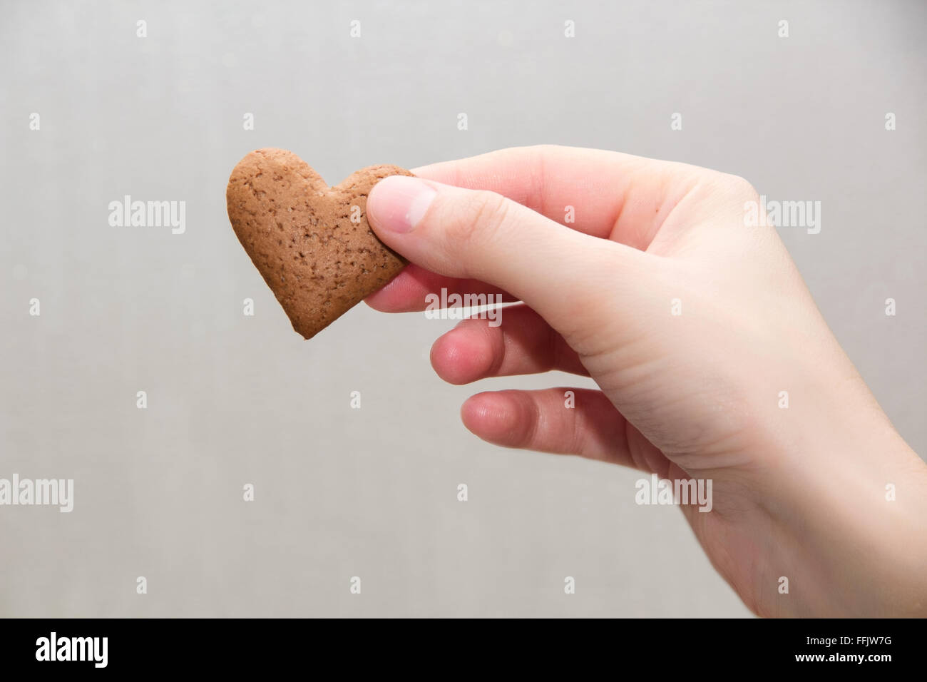 gingerbread in hand Stock Photo - Alamy