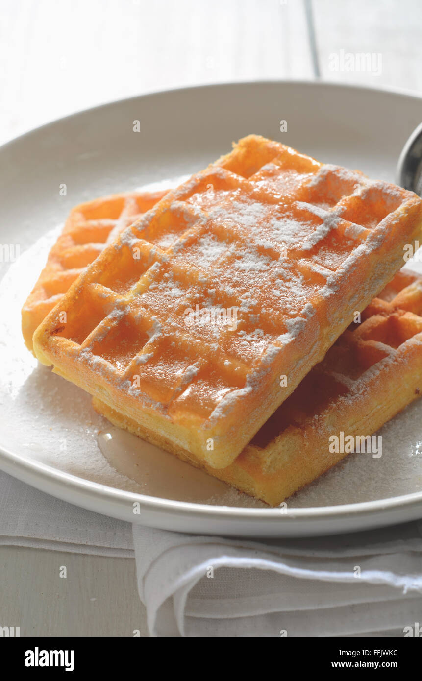 Traditional Belgian Waffles on a white plate Stock Photo - Alamy