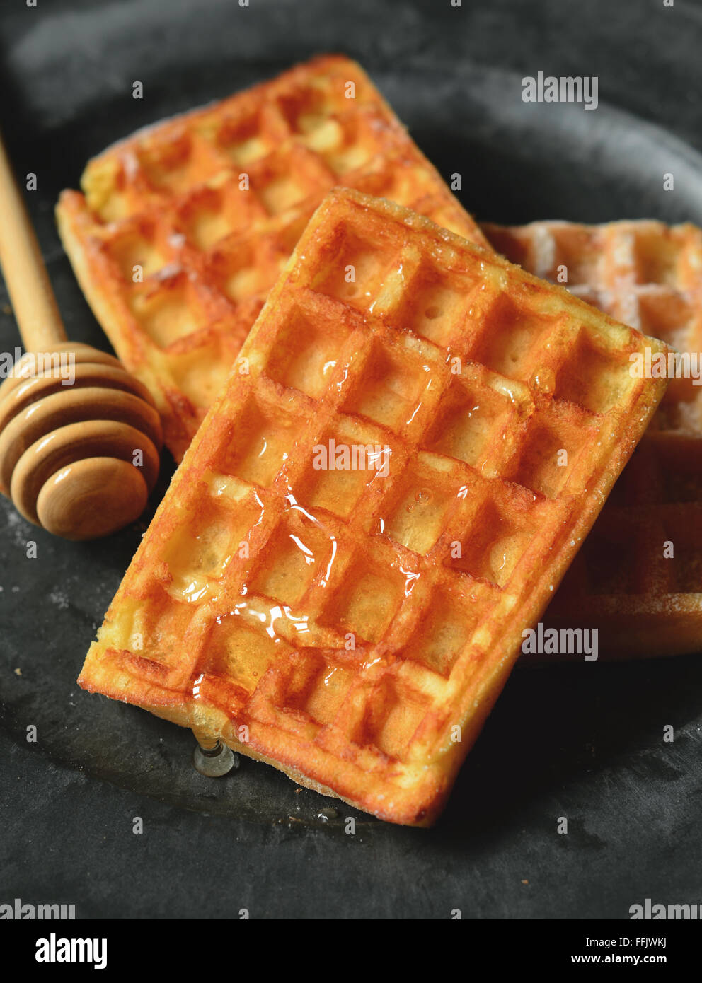 Traditional Belgian Waffles on a dark grey plate Stock Photo - Alamy