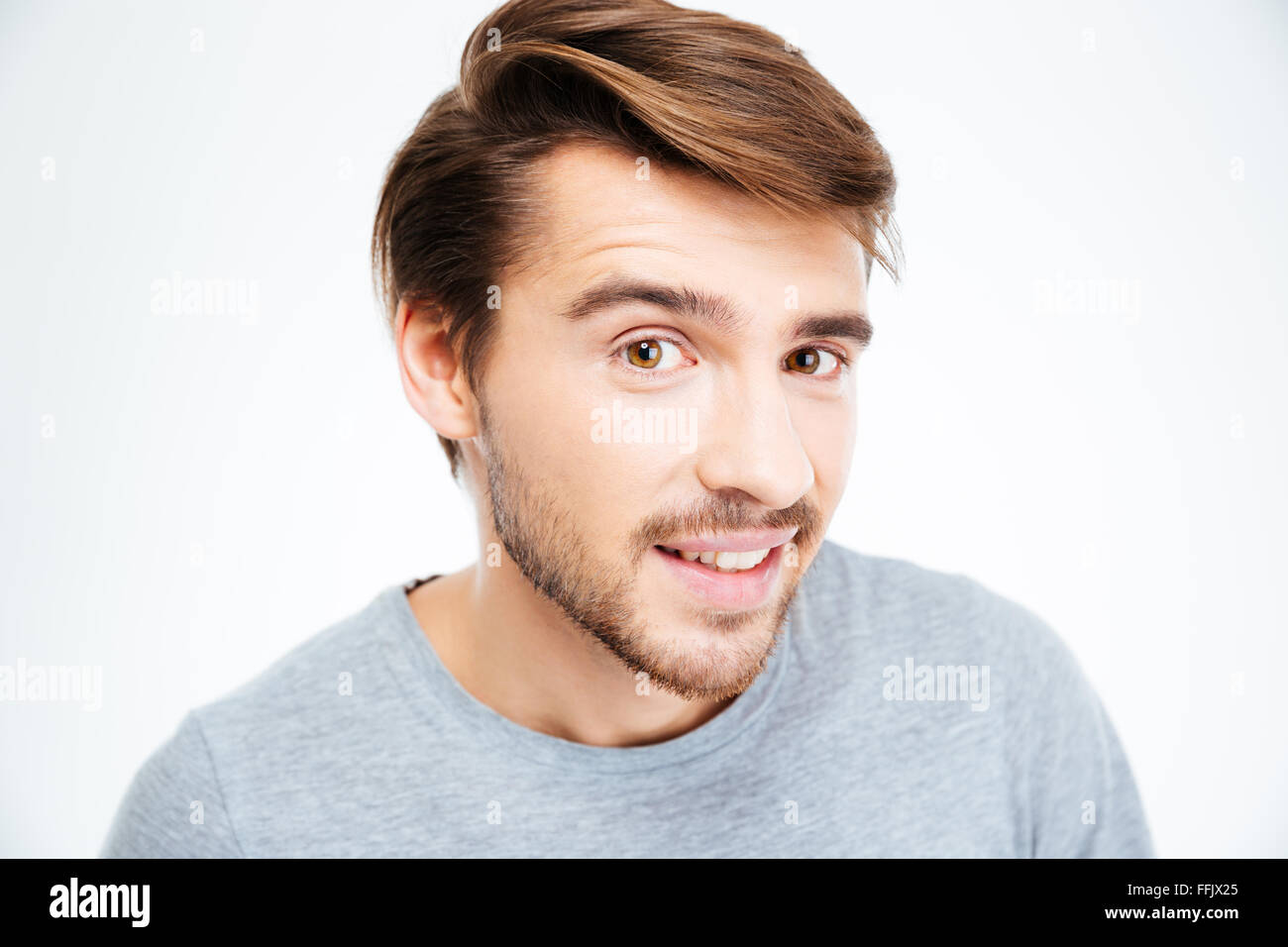 Closeup portrait of a cheerful man looking at camera isolated on a ...