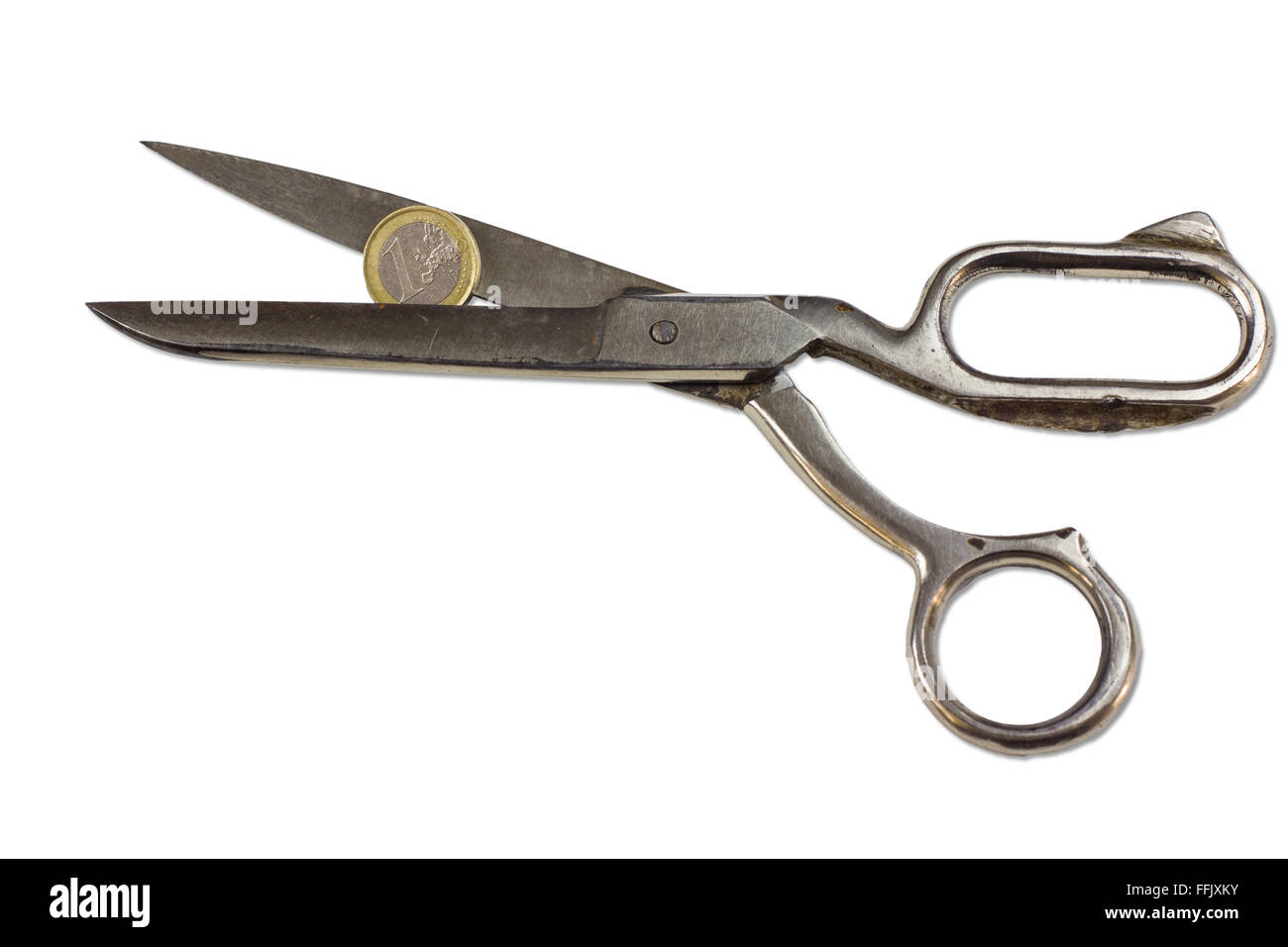 Budget cuts - coins between scissors isolated Stock Photo - Alamy