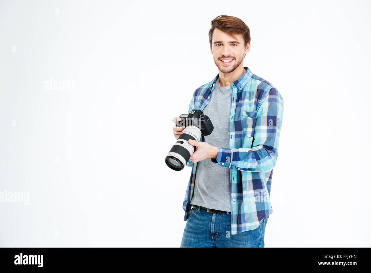 Casual male photographer holding photo camera isolated on a white ...