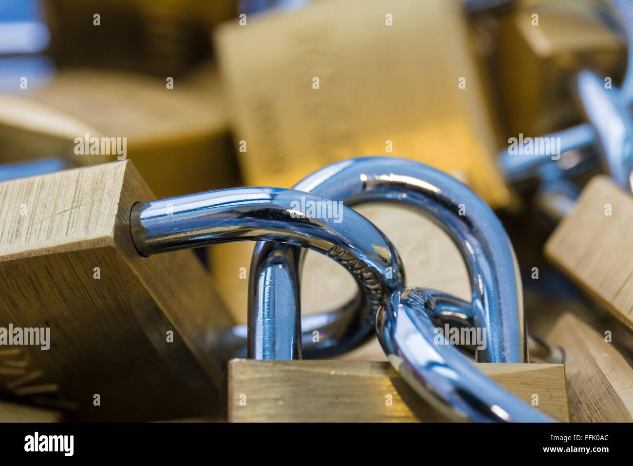 Close up metal padlocks locked together Stock Photo - Alamy