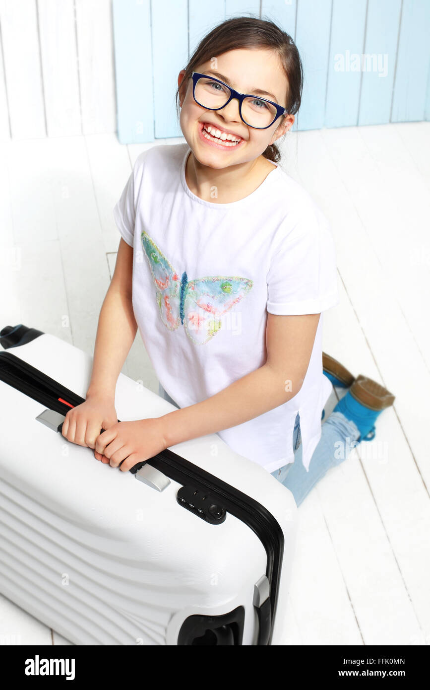 Girl packing suitcase hi-res stock photography and images - Alamy