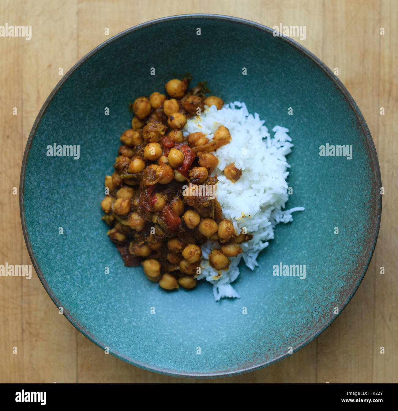 Red chickpea curry with white rice Stock Photo - Alamy