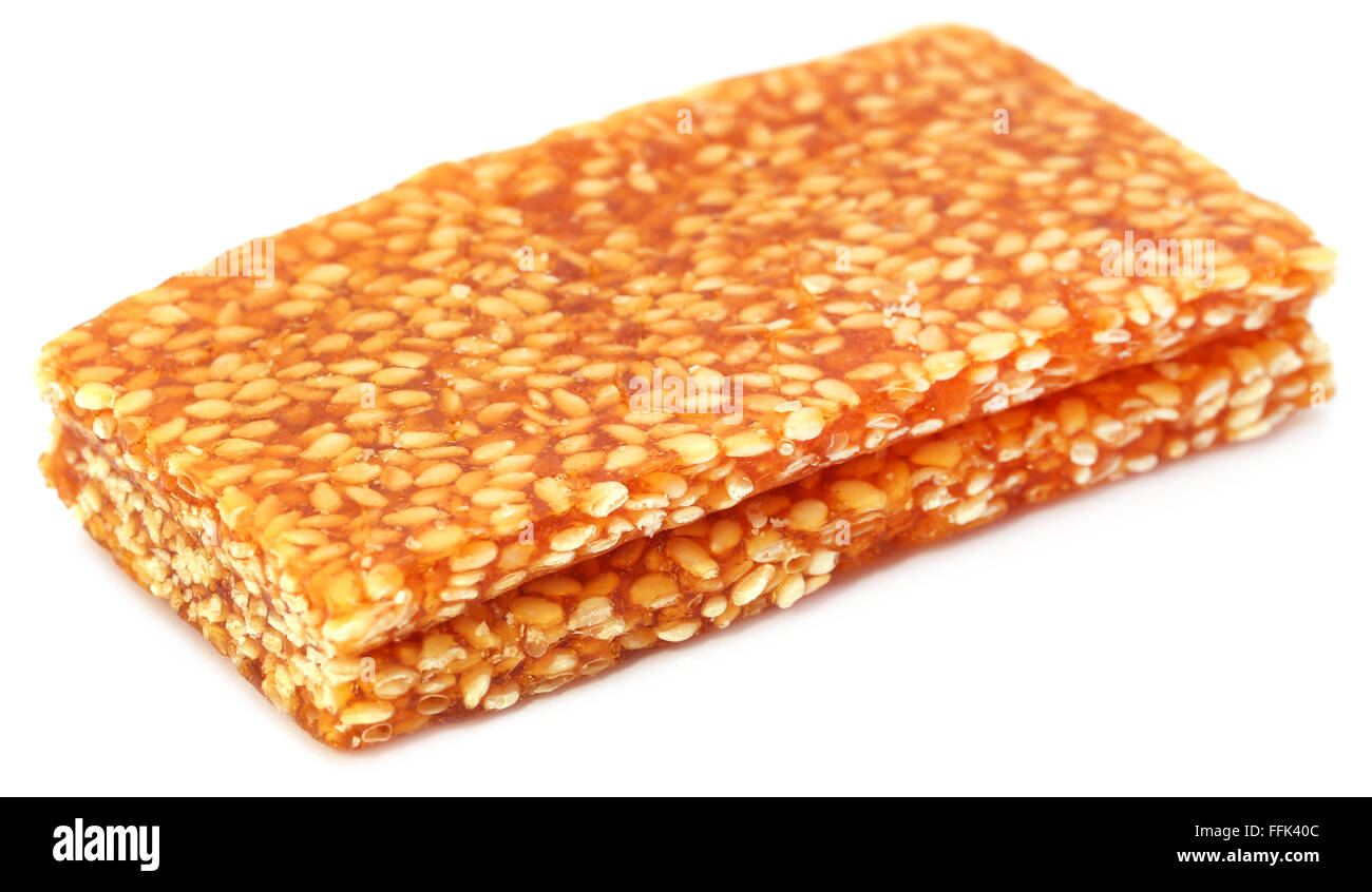 Jaggery sesame Candy over white background Stock Photo - Alamy