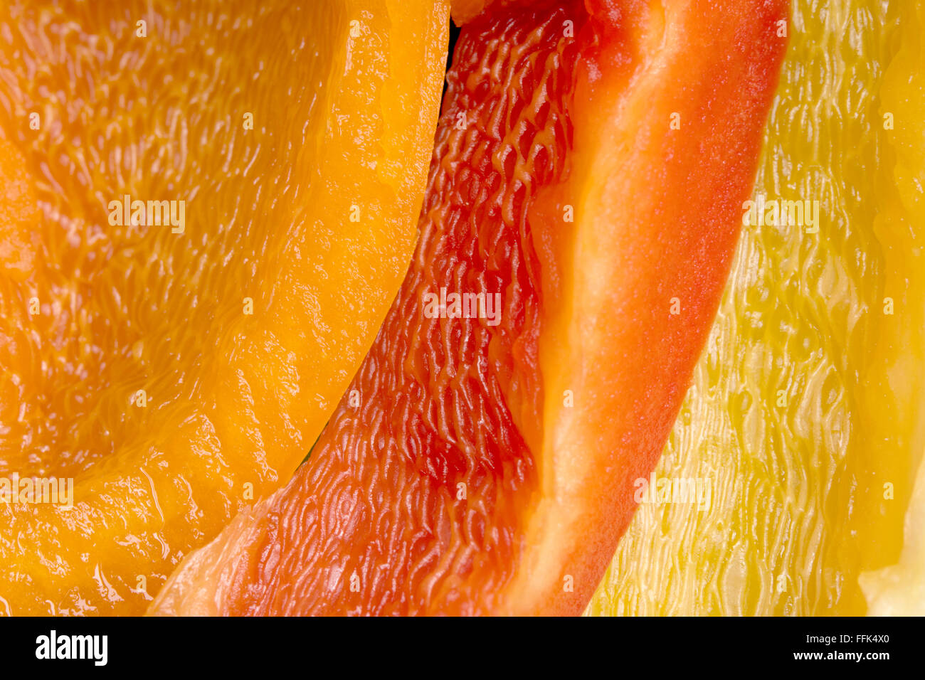 red, orange, yellow bell peppers sliced abstract Stock Photo - Alamy