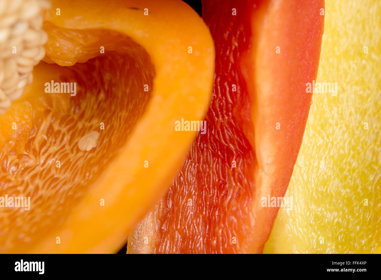 red, orange, yellow bell peppers sliced abstract Stock Photo - Alamy