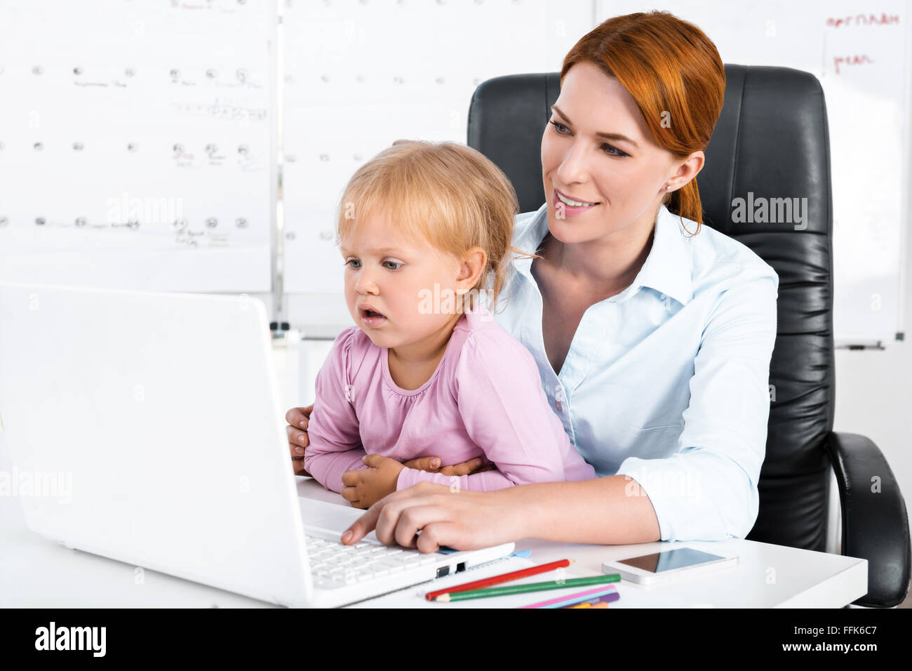Business woman and daughter while working day Stock Photo - Alamy