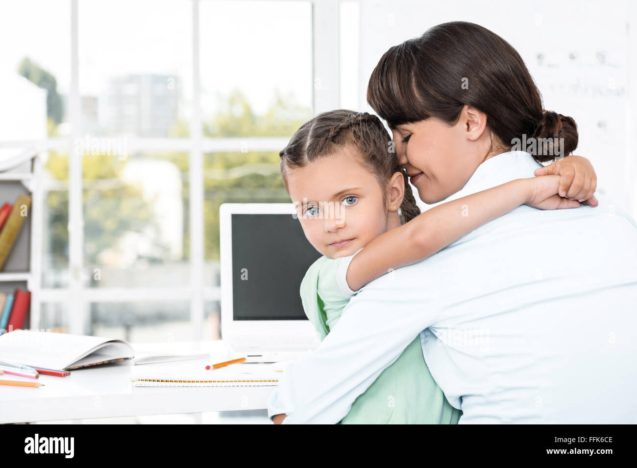 Business woman and daughter while working day Stock Photo - Alamy