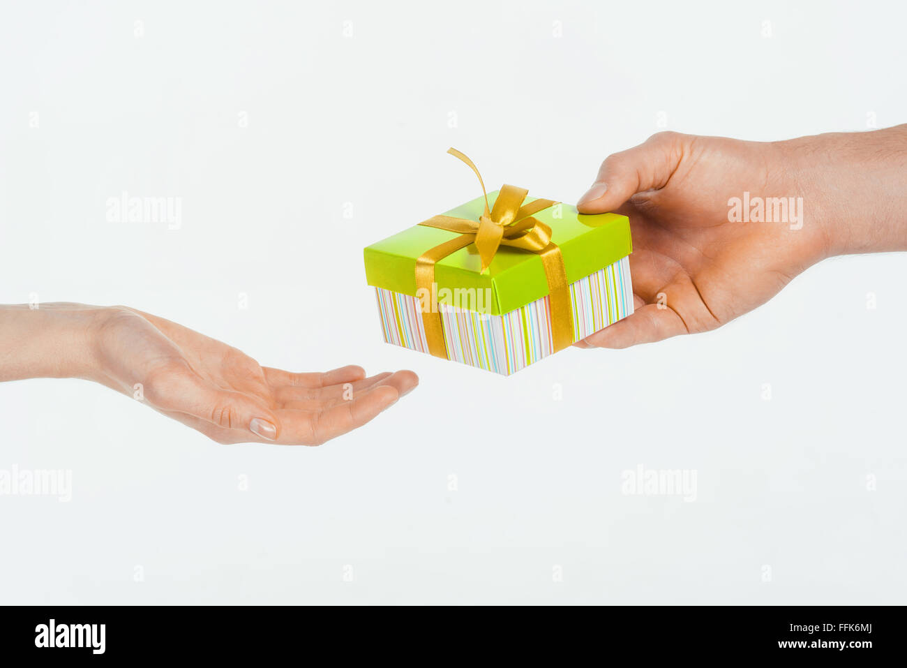 Nice photo of two hands with gift Stock Photo - Alamy