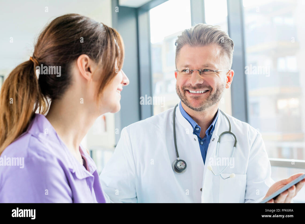 Doctor and nurse with digital tablet in hospital Stock Photo - Alamy