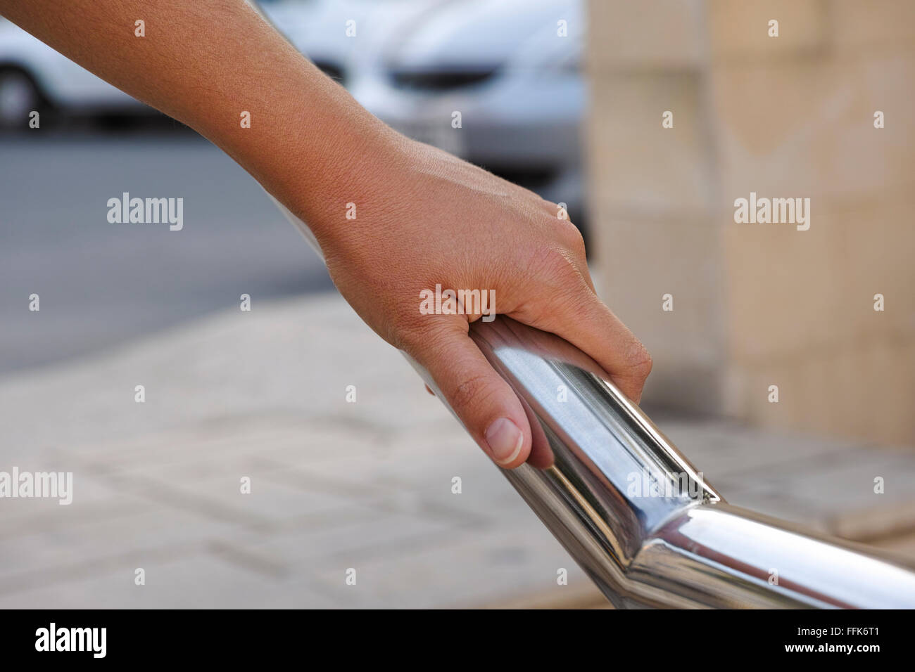 Hand gripping railing hi-res stock photography and images - Alamy