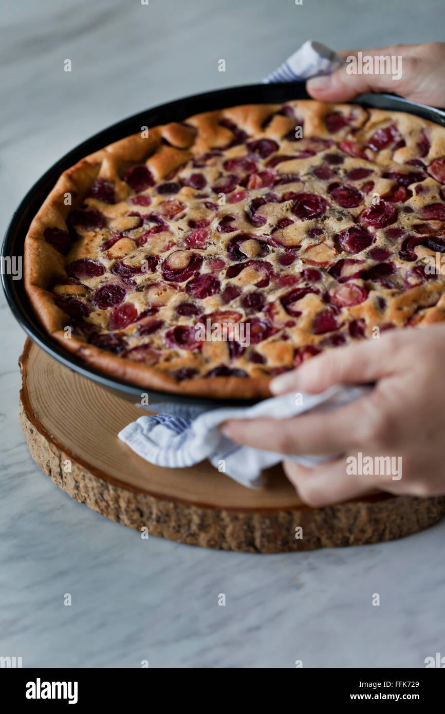 Baked cherry clafoutis in a baking pan Stock Photo - Alamy