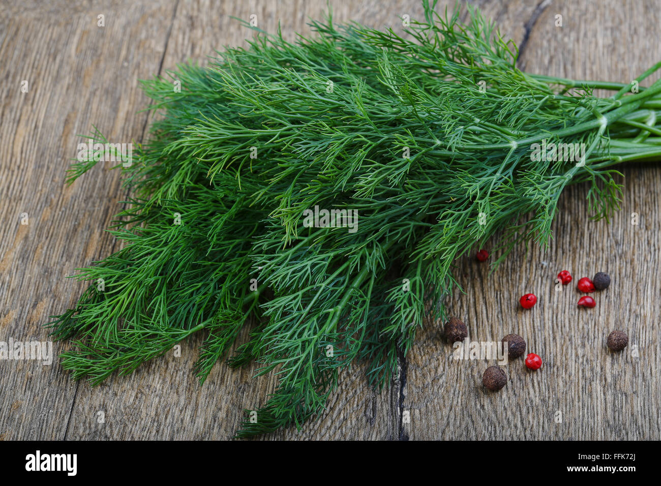Fresh green dill heap on the wood background Stock Photo - Alamy