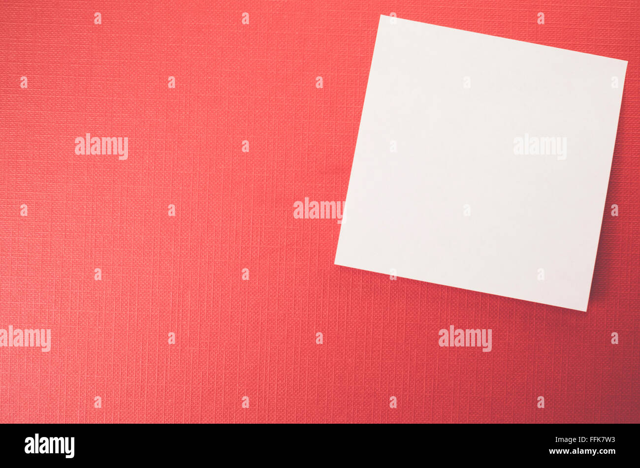 white blank memo with black banner on a red textured surface - copy ...
