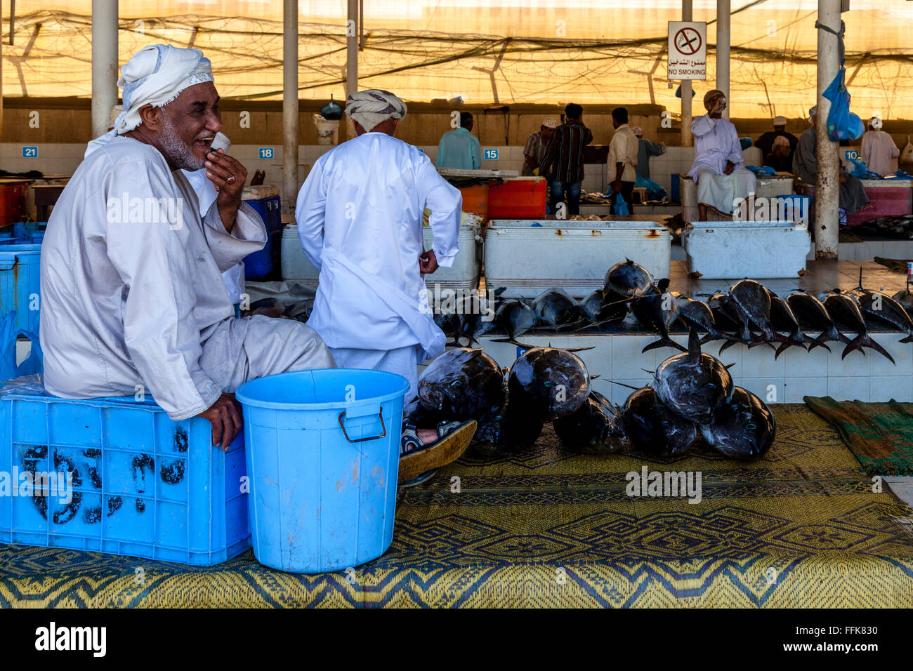 An Omani Man Sells Fish At The Fish Market, Muttrah, Muscat, Sultanate ...